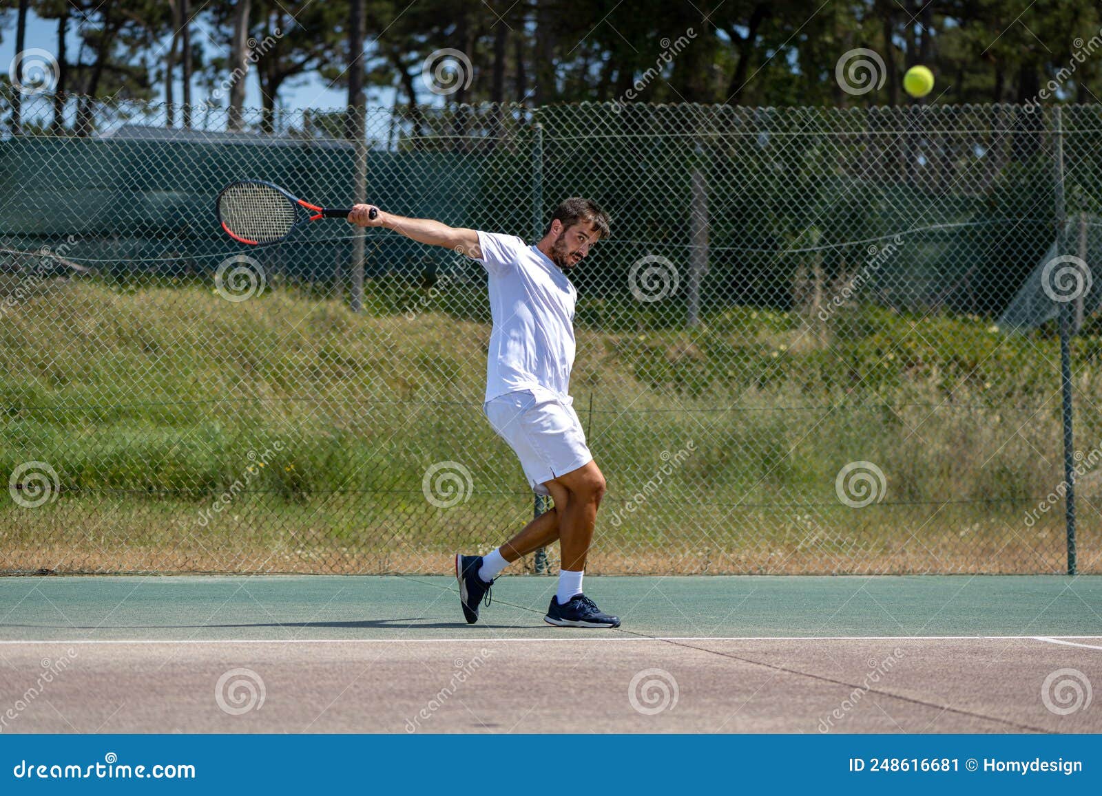 Tennis Player Hitting Backhand at Ball Stock Image - Image of club ...