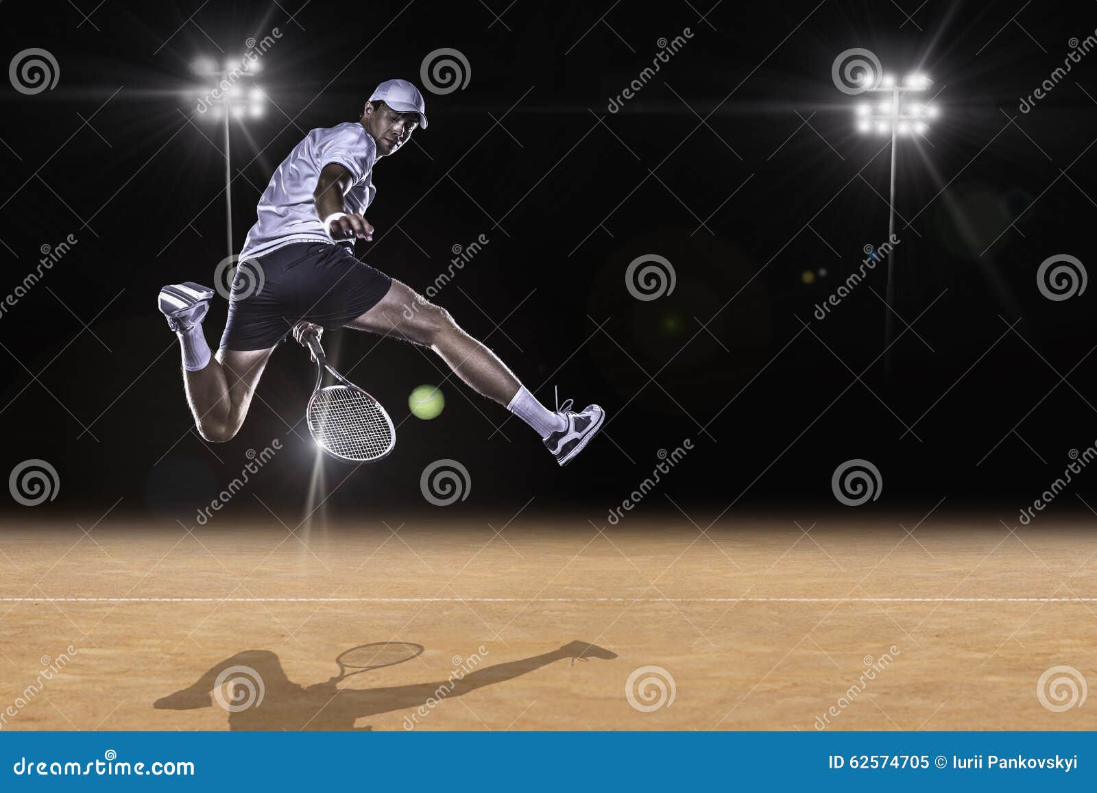 Tennis Player Reaching for the Hard Ball Stock Image - Image of lights ...