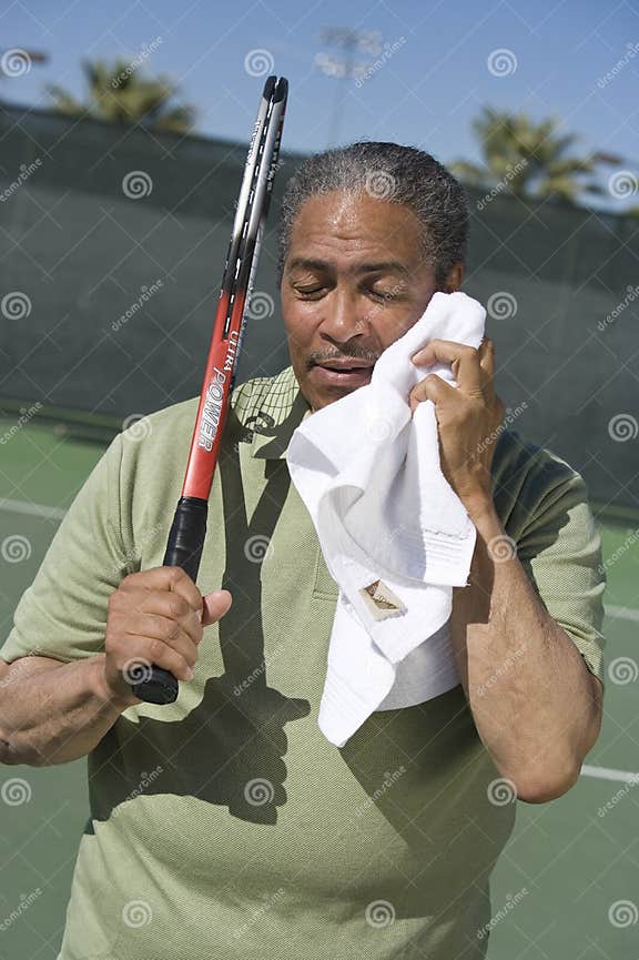 Tennis Player Sweeping Out the Sweat Stock Photo - Image of active ...