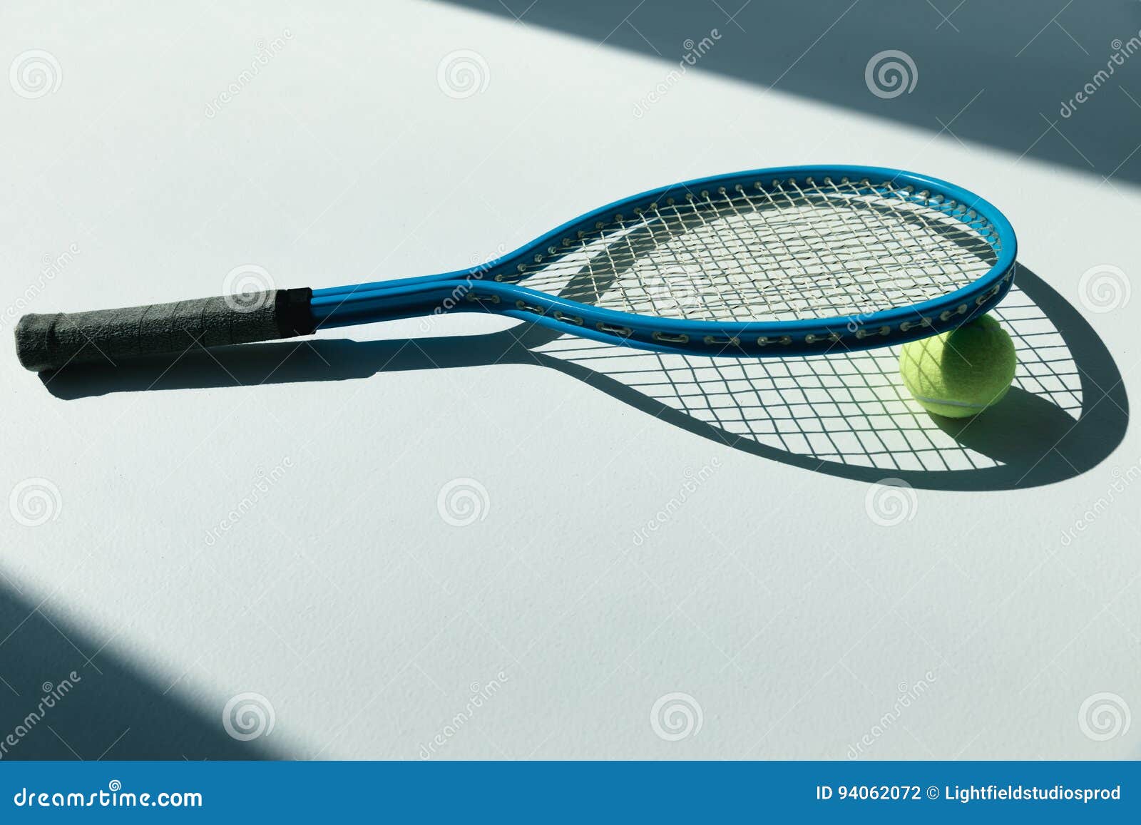 Tennis Racket and Ball on the Floor Stock Photo - Image of daylight ...