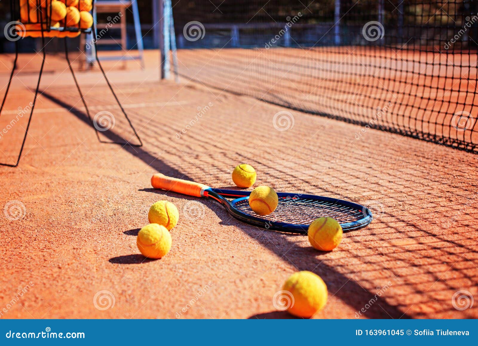 Tennis Racket and Balls Laying on the Ground Stock Image - Image of ...