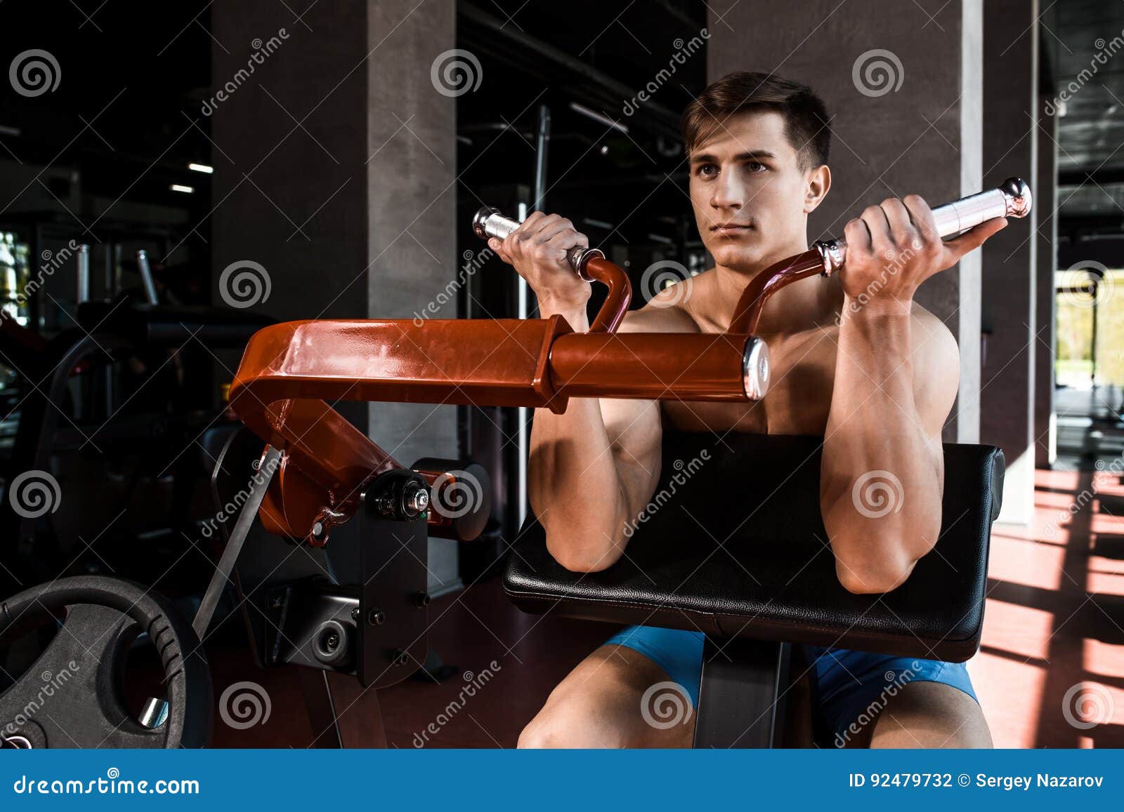 Tense Muscles of Hands Under Load. Man Doing Exercise for Biceps in the ...
