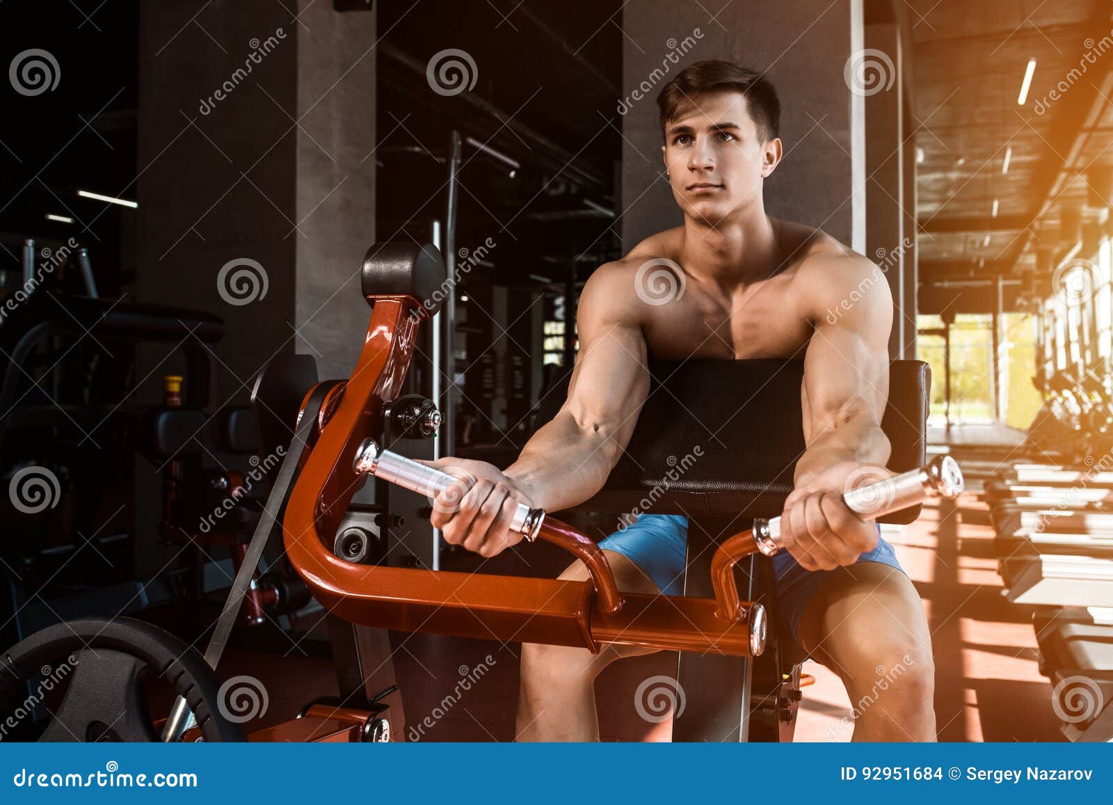 Tense Muscles of Hands Under Load. Man Doing Exercise for Biceps in the ...