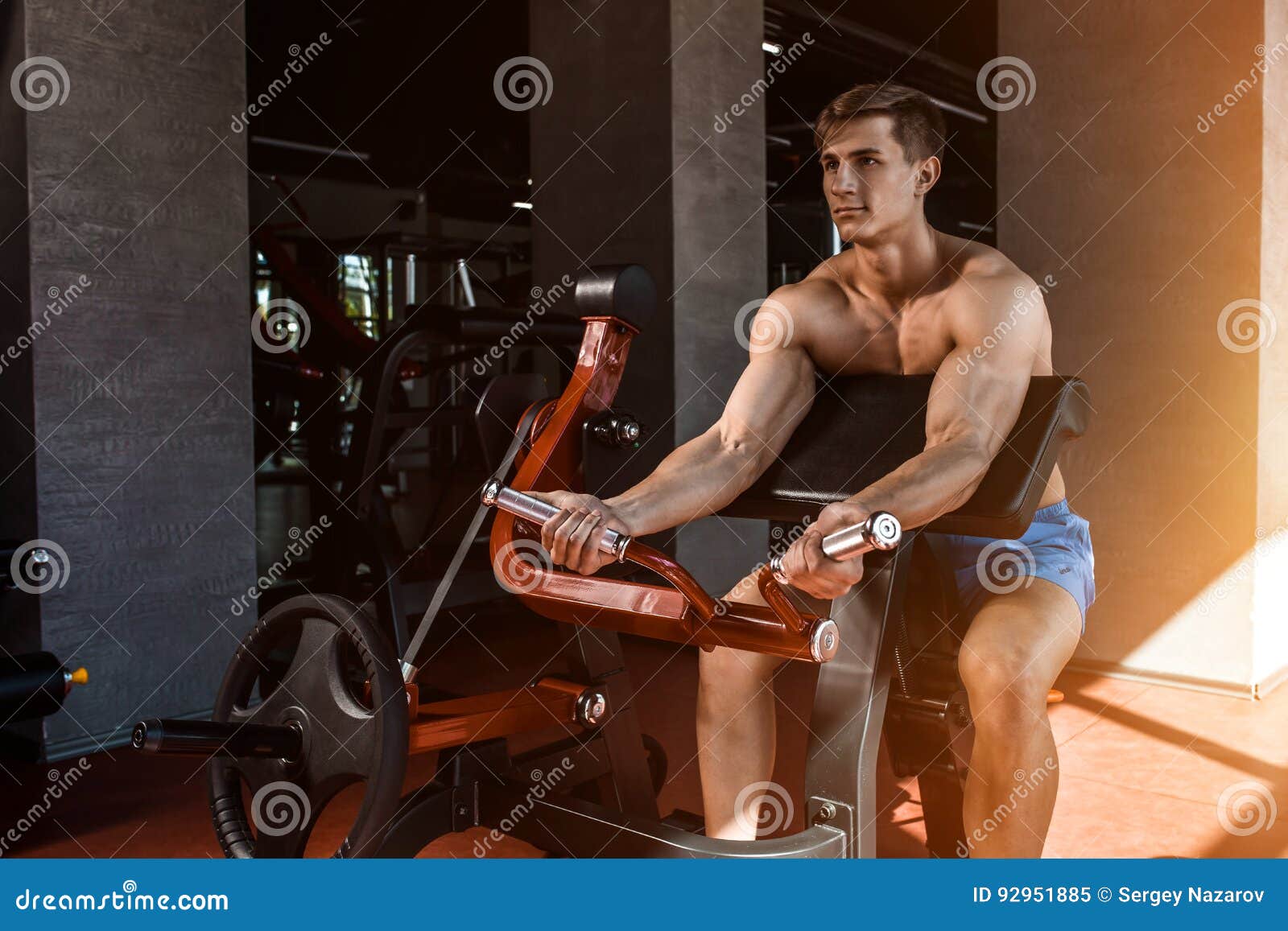 Tense Muscles of Hands Under Load. Man Doing Exercise for Biceps in the ...