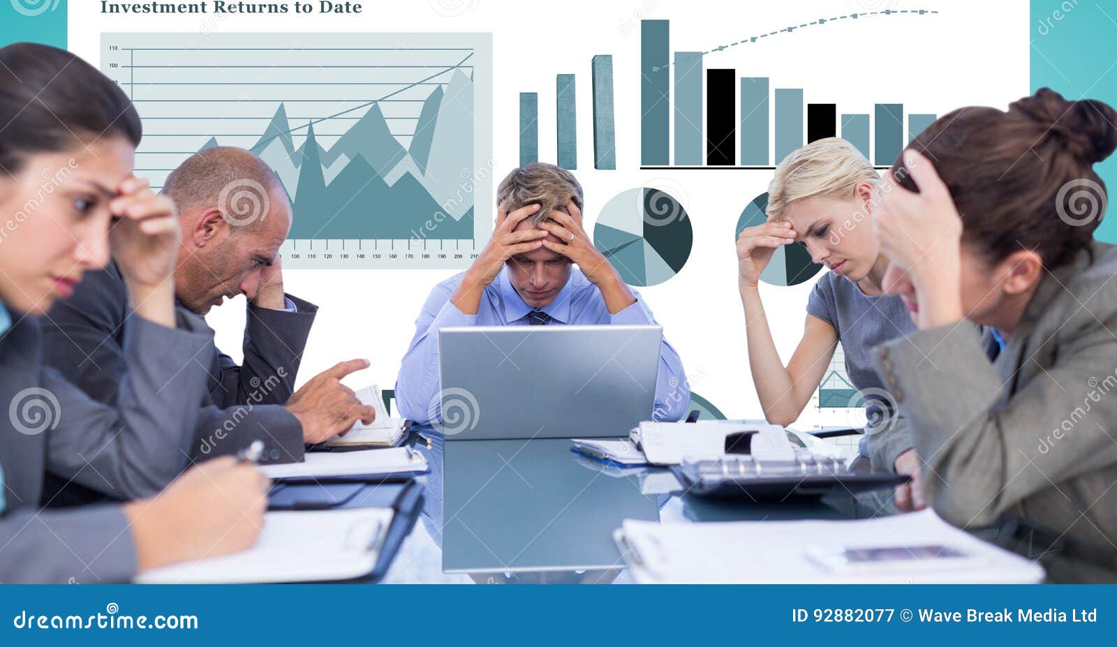 Tensed Business People with Head in Hands Against Graphs Stock ...