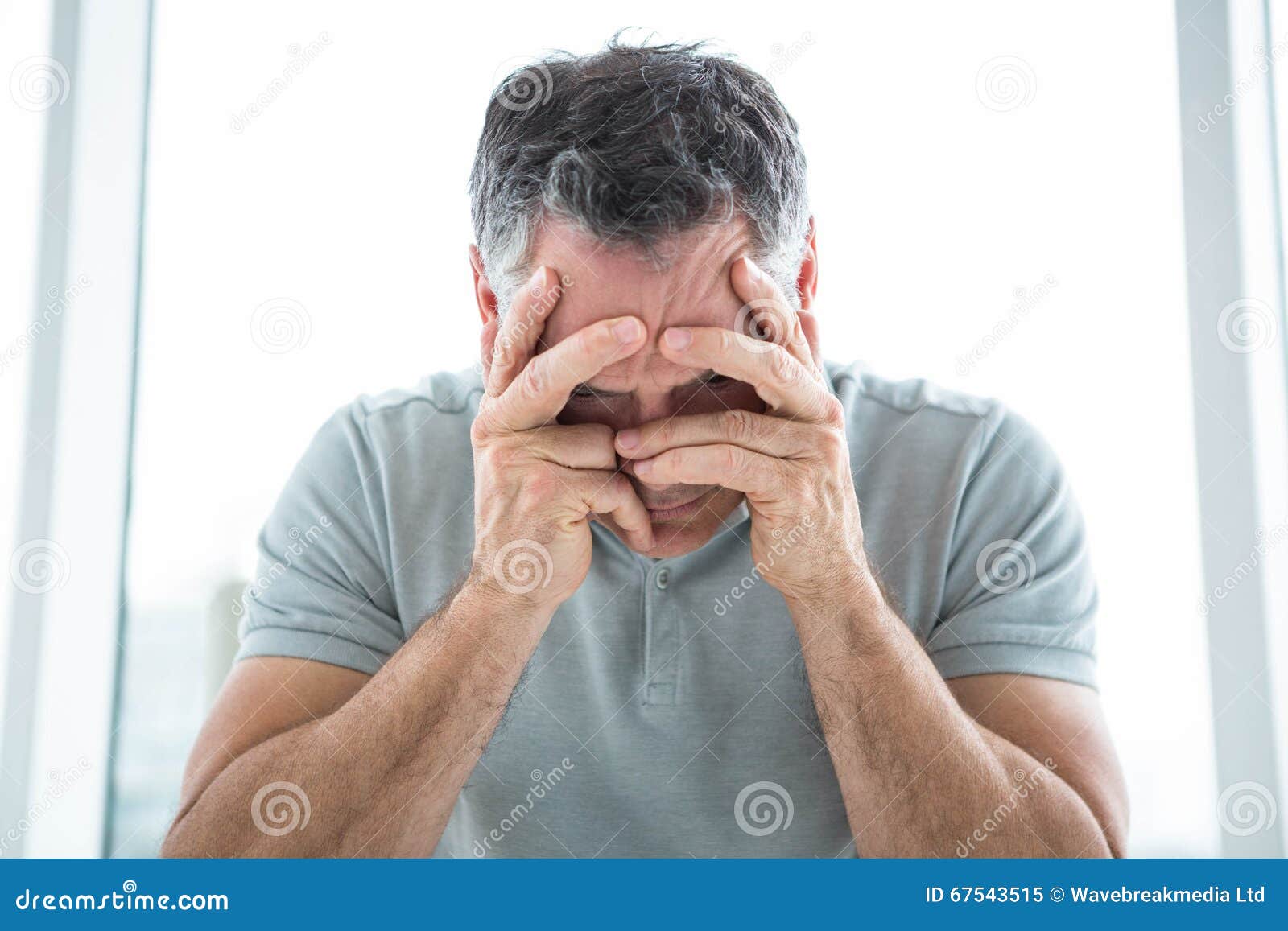 Tensed Man Sitting and Thinking Against Window Stock Image - Image of ...