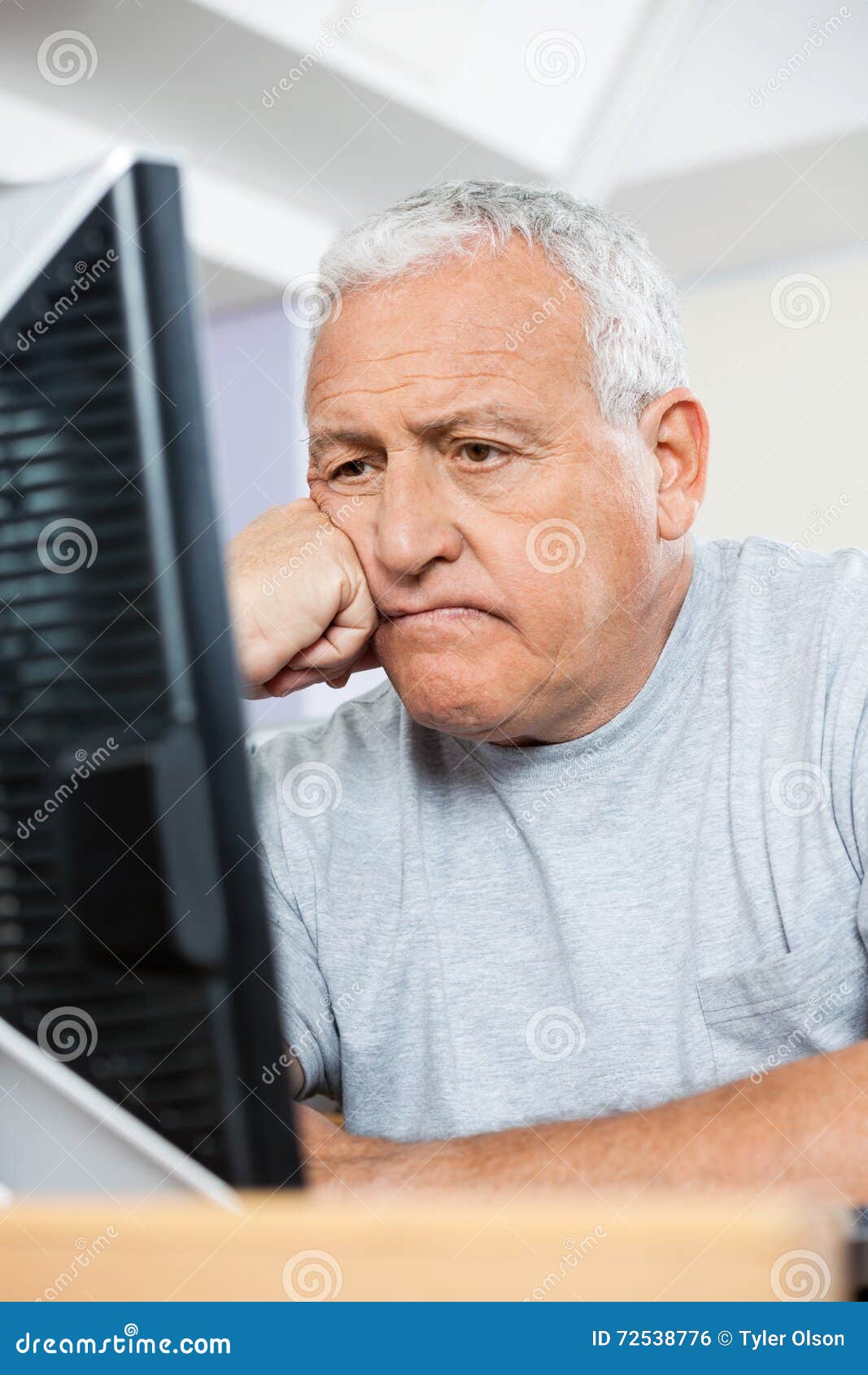 Tensed Senior Man Looking at Computer in Class Stock Photo - Image of ...