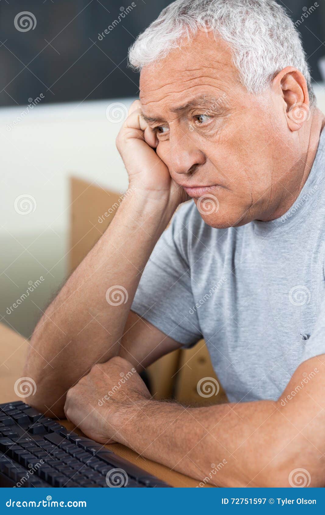 Tensed Senior Student Looking at Computer Stock Image - Image of ...