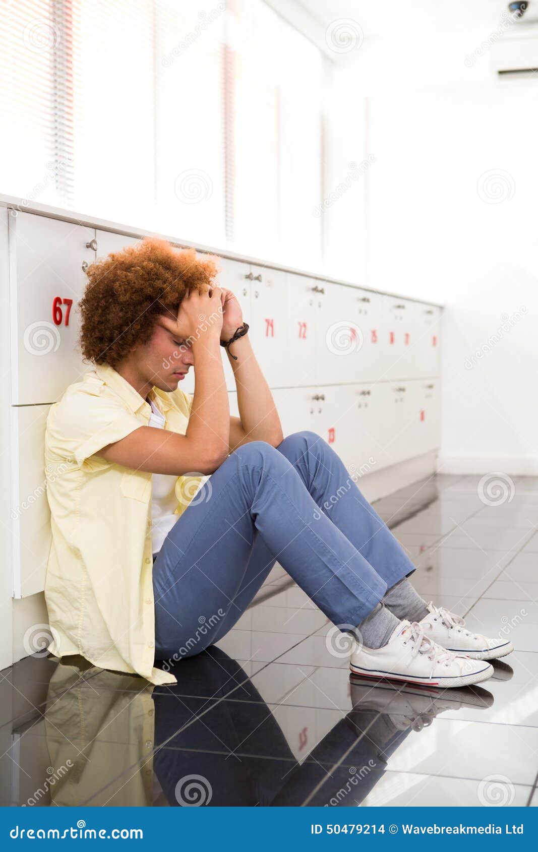 Tensed Young Man in Office Corridor Stock Photo - Image of side ...