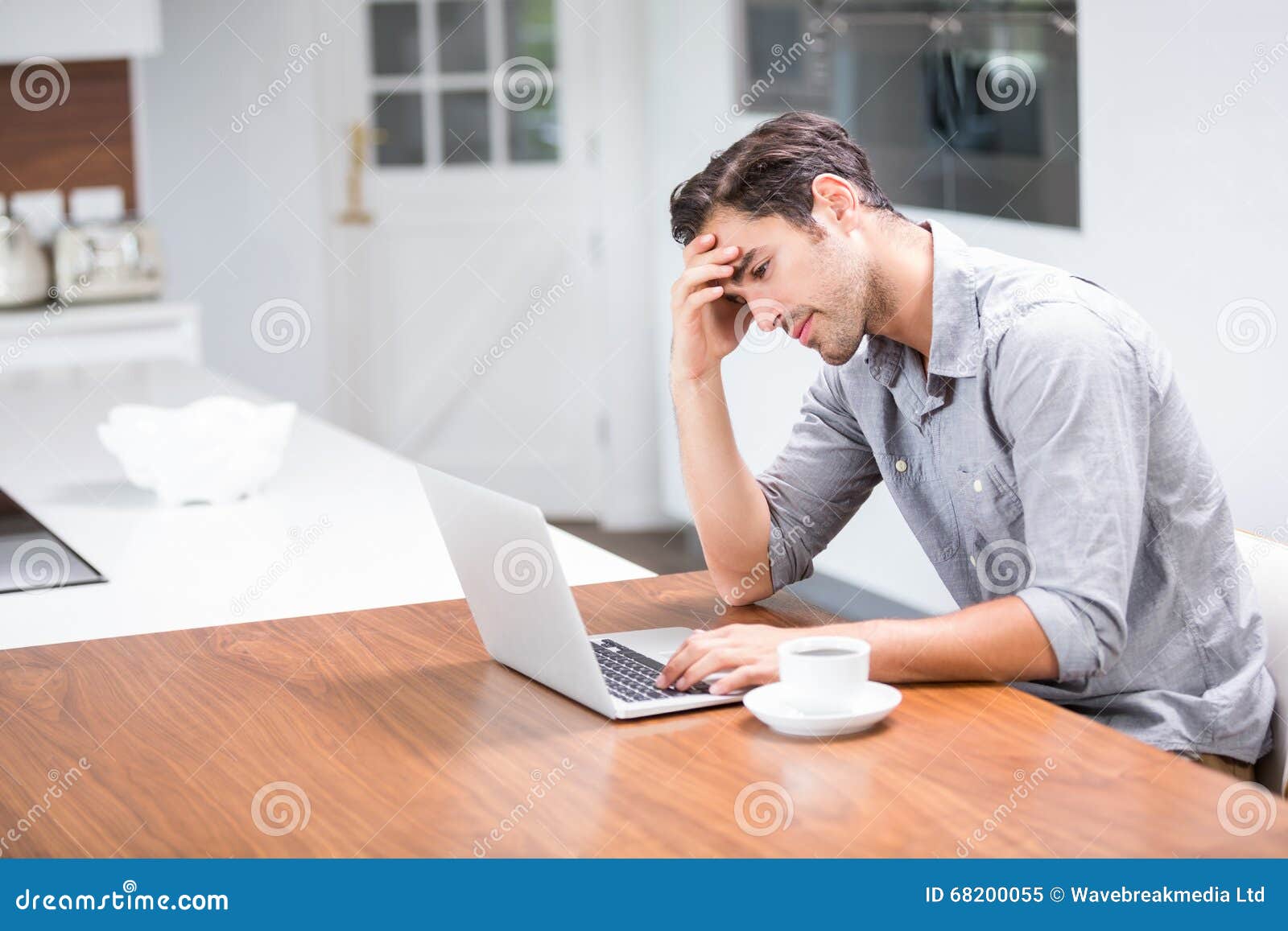 Tensed Young Man Using Laptop Stock Image - Image of house, caucasian ...