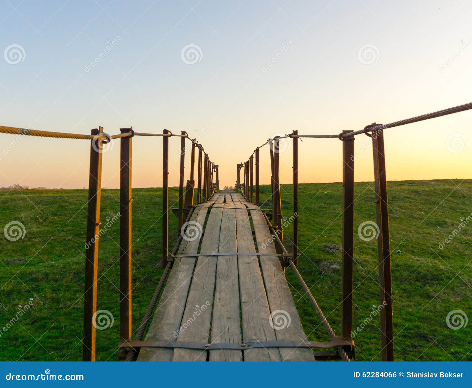 Tension Bridge Stretching into Sunset Stock Photo - Image of adventure ...