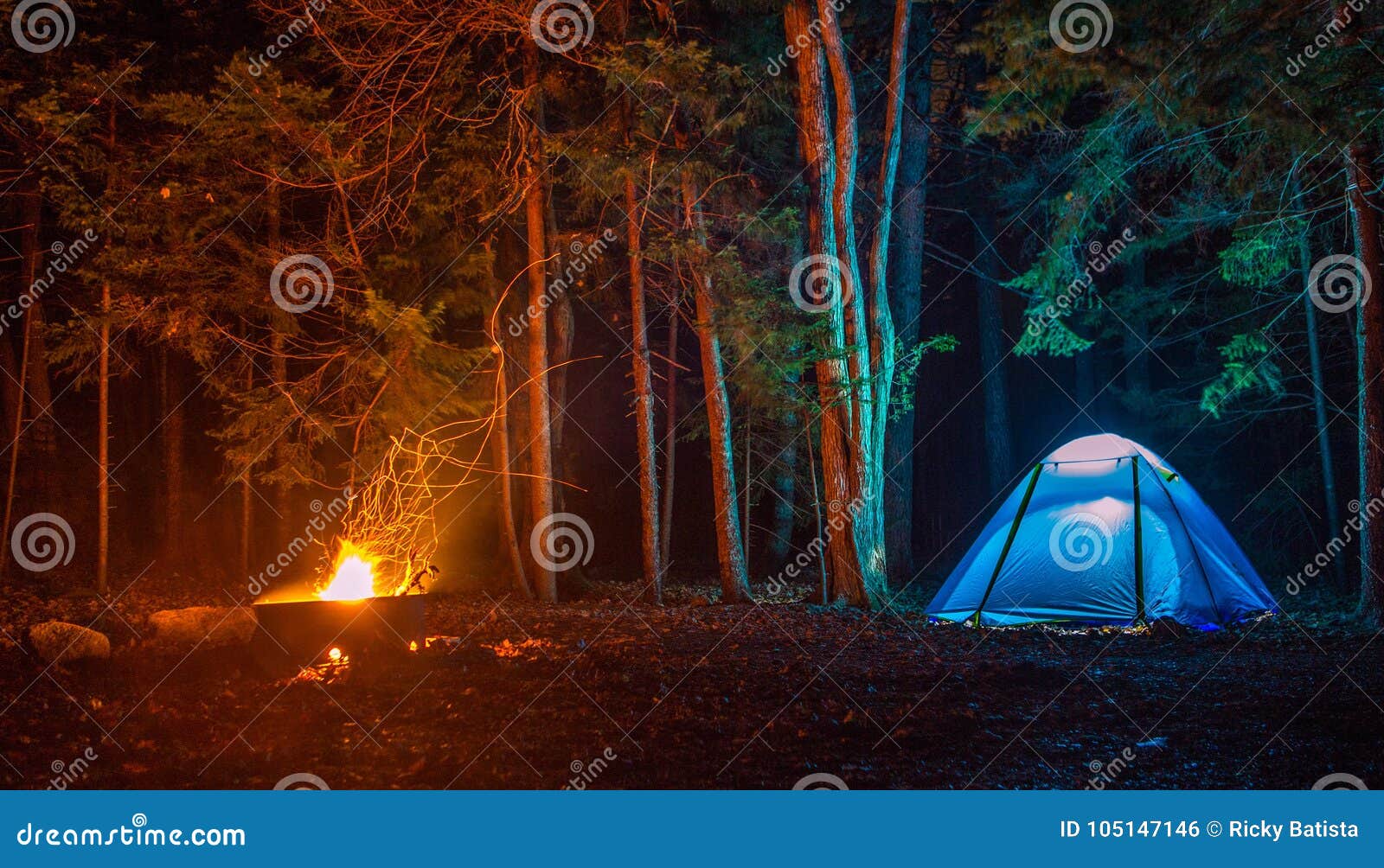 Tent at Night Lit Up with Fire Pit Burning on a Campground Stock Photo ...