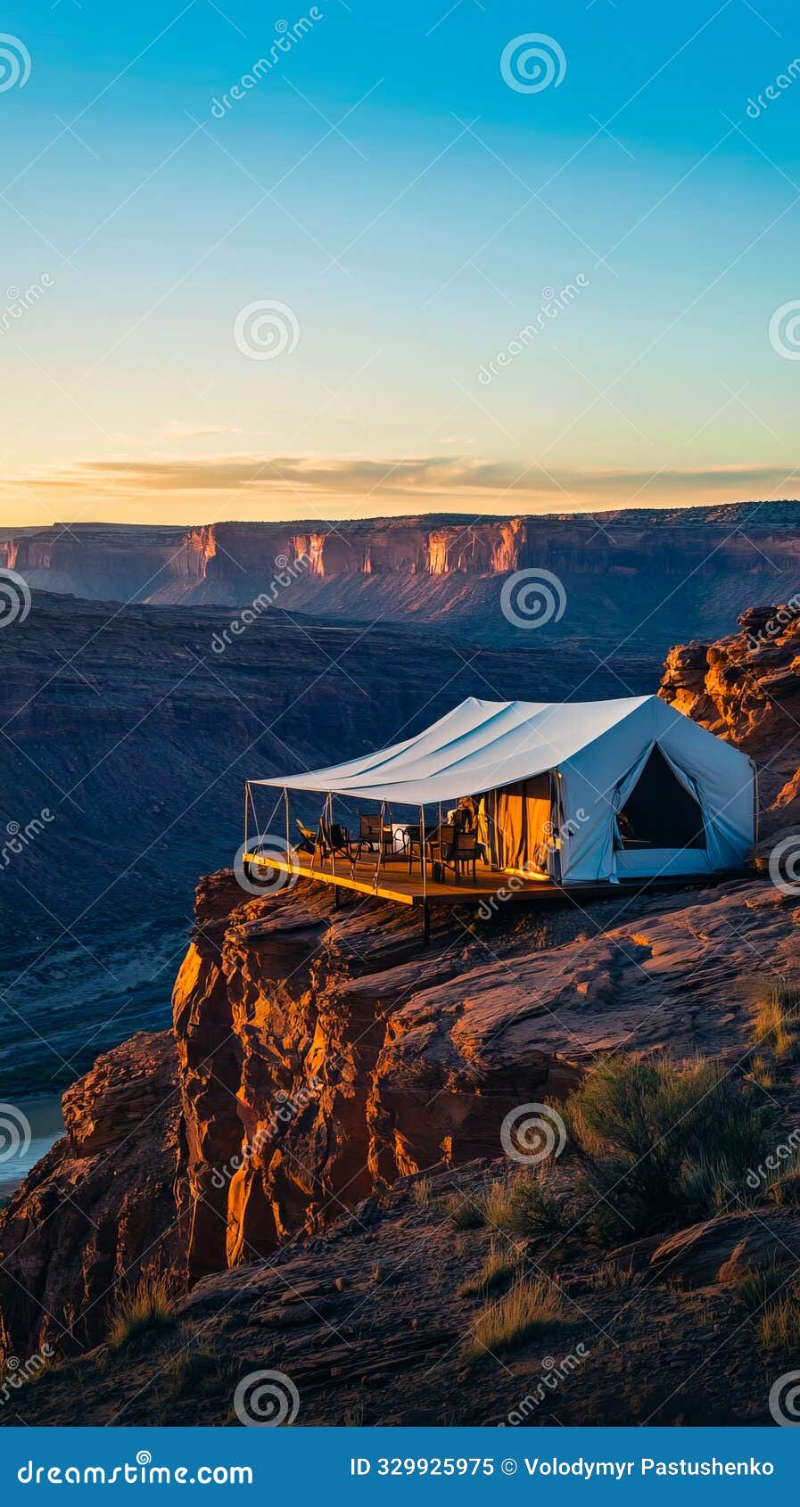 A Tent Pitched Up on Top of a Cliff Overlooking a River Stock Image ...