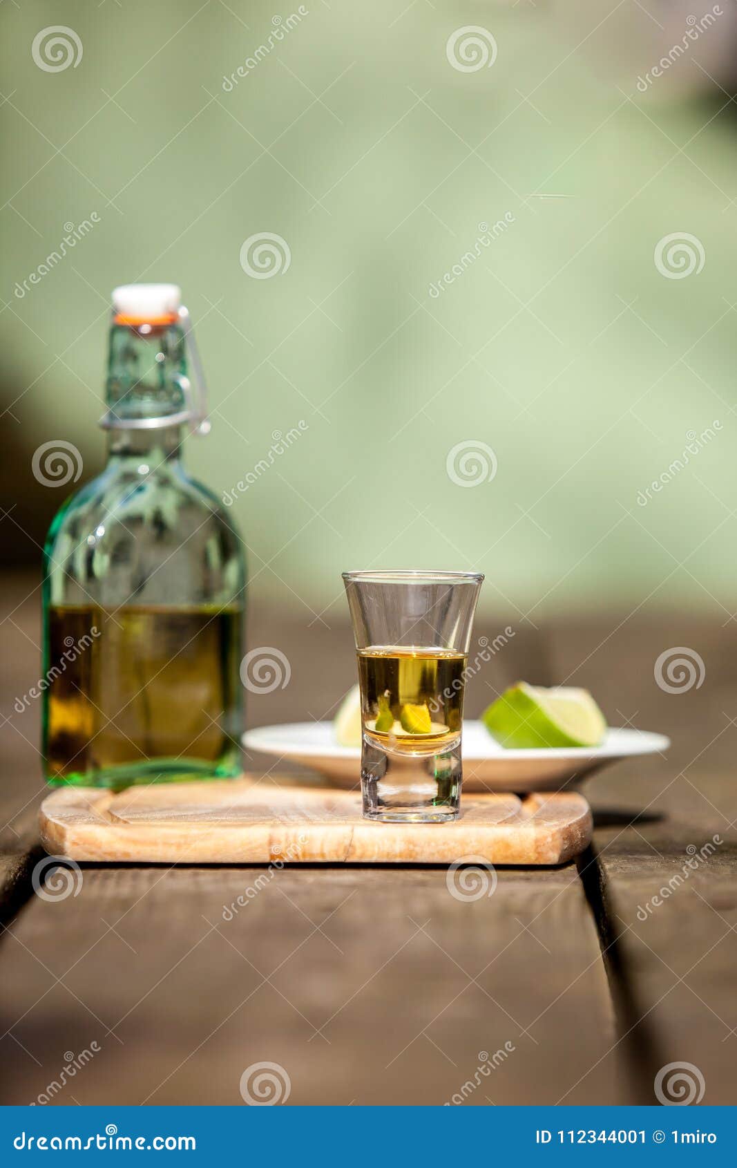 Tequila in glass stock image. Image of table, time, green - 112344001