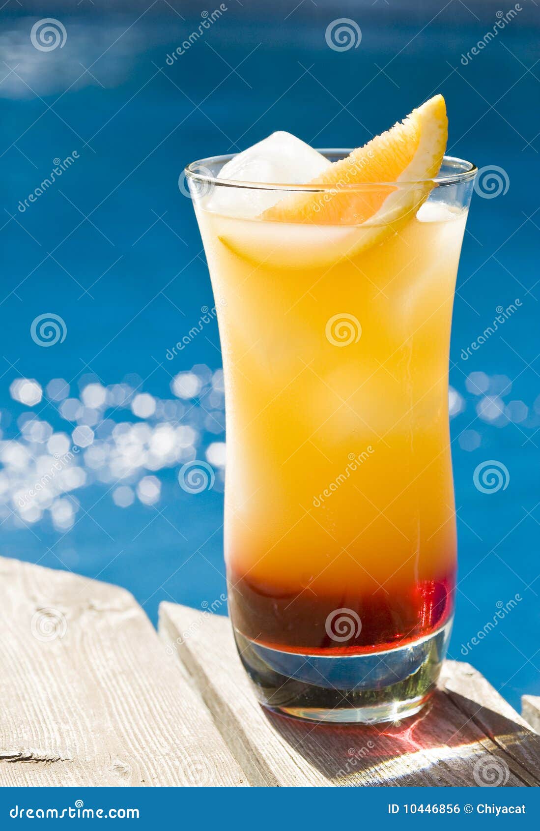 Tequilla Sunrise Cocktail by the Pool Stock Photo - Image of deck ...