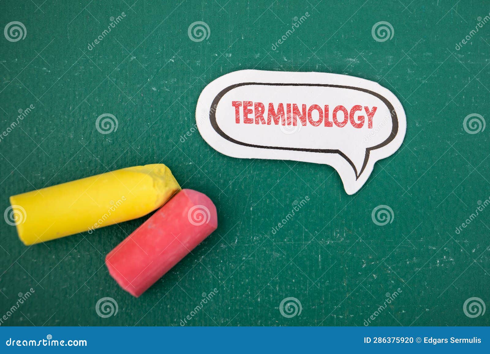 TERMINOLOGY Concept. Speech Bubble and Colored Pieces of Chalk on a ...