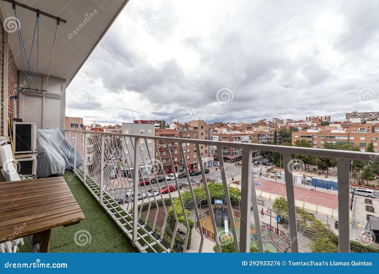 A Terrace with Artificial Grass Floor with White Railing, Clothesline ...