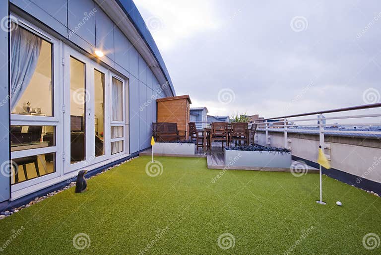 Terrace with a golf pitch stock image. Image of bench - 10548523
