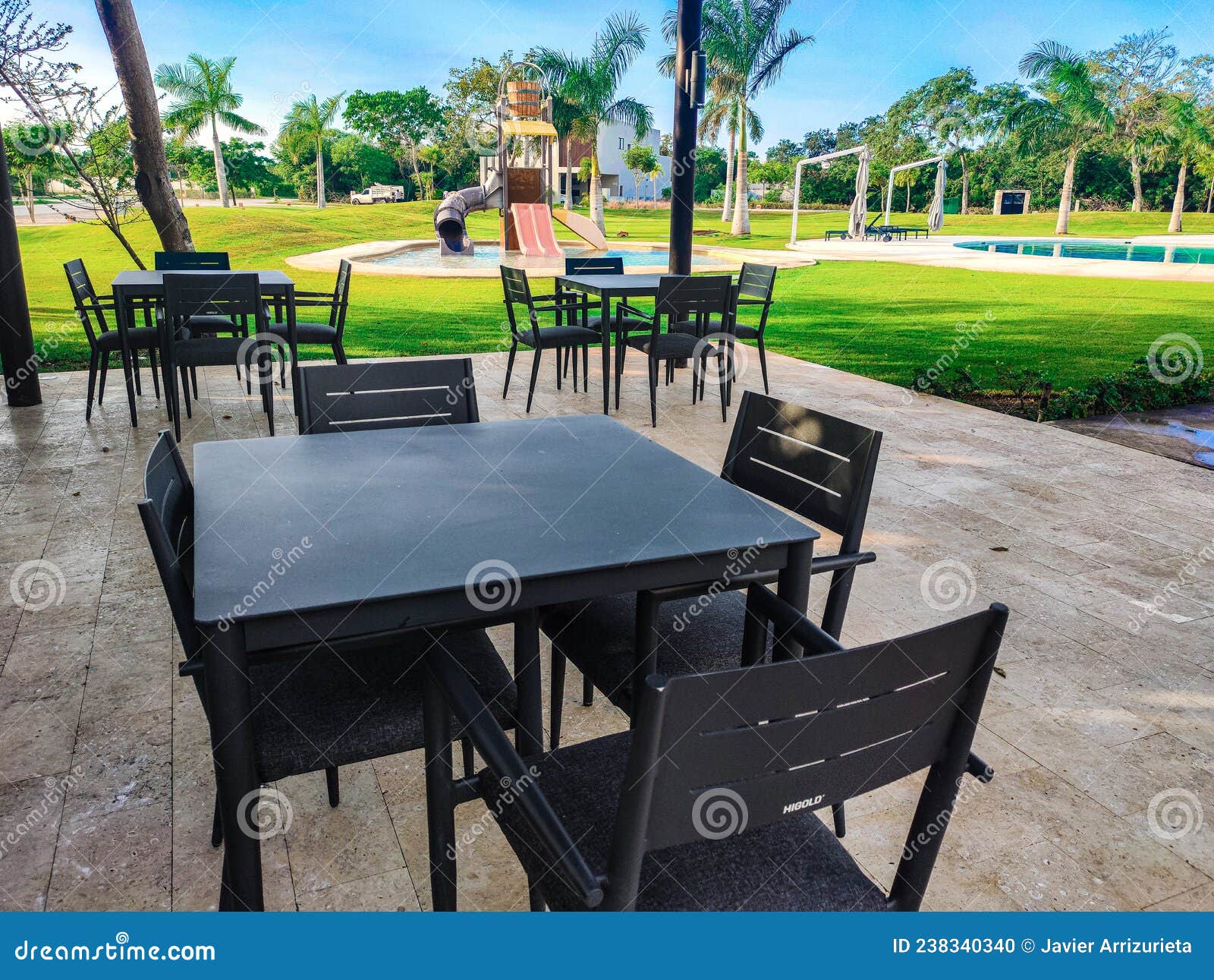 Terrace, Playground and Pool with Slide Inside a Private Residential ...