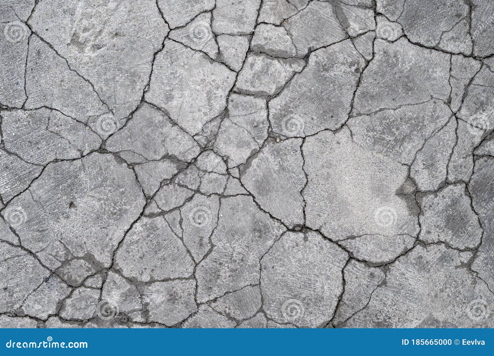 Terrain Road with Small Rocks and Cracks on the Concrete. Stock Photo ...