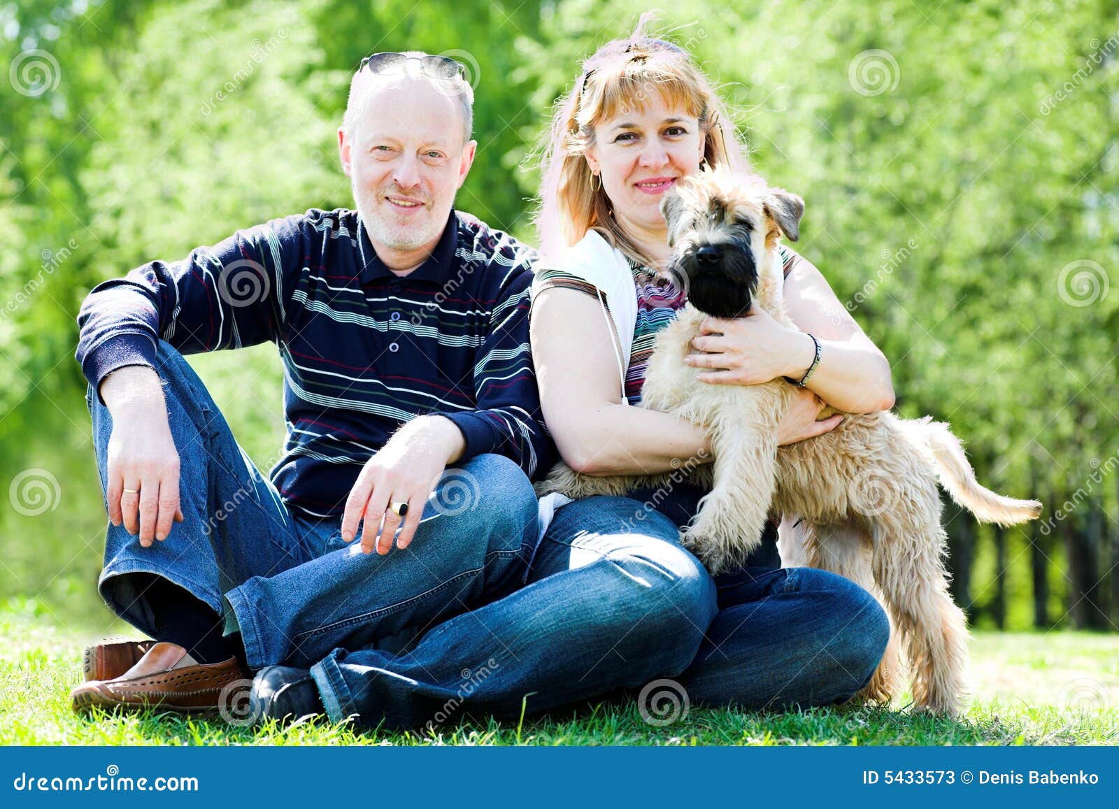 Terrier dog and family stock image. Image of coated, hold - 5433573