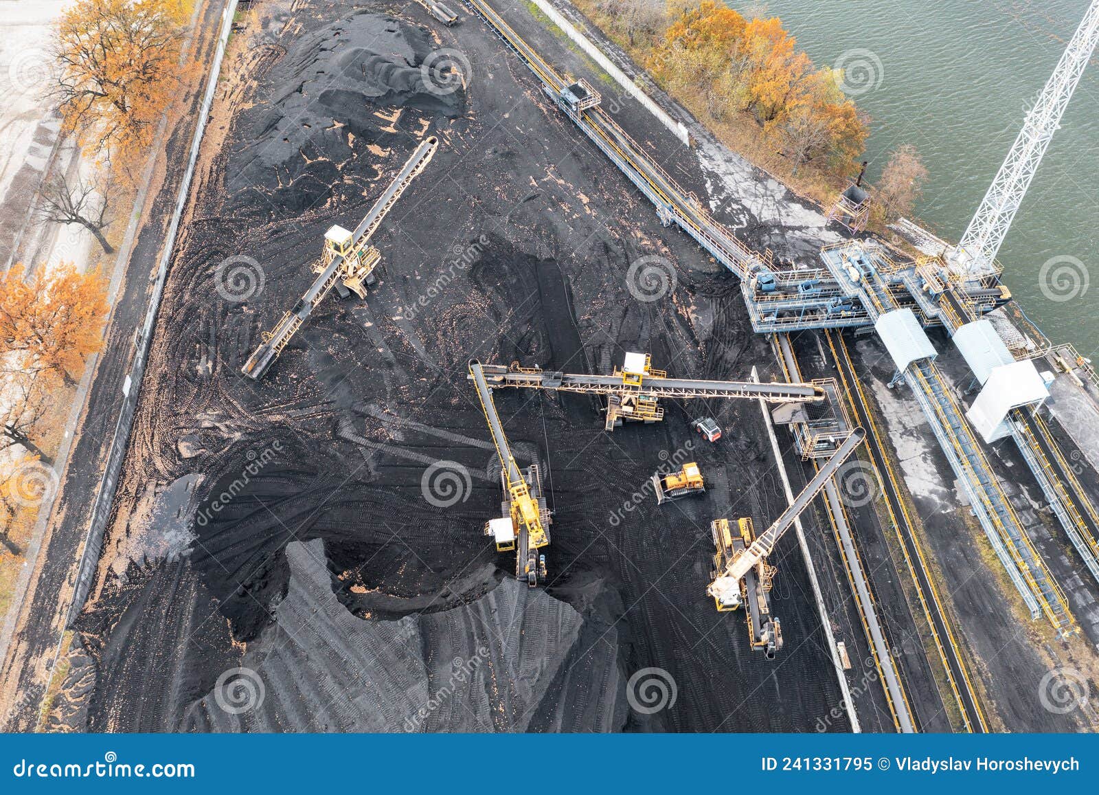 Territory of the Coal Terminal with Coal Dumps and a Regenerator ...