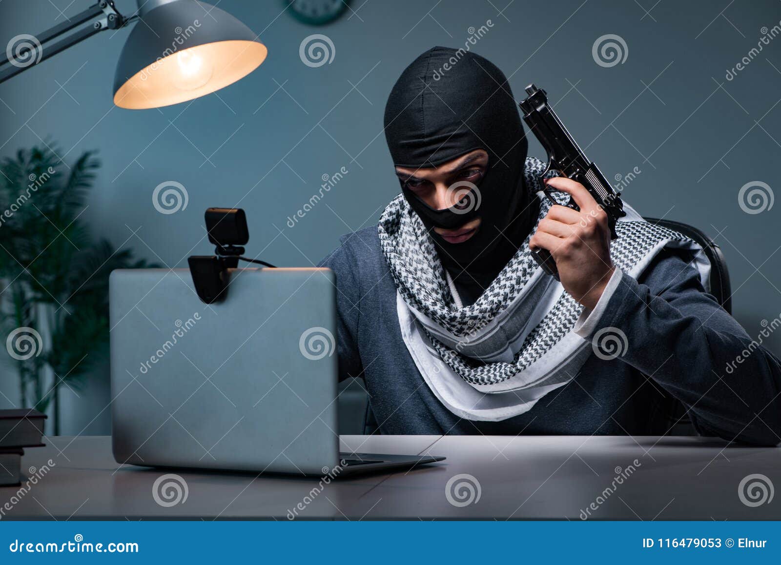 The Terrorist Burglar with Gun Working at Computer Stock Image - Image ...