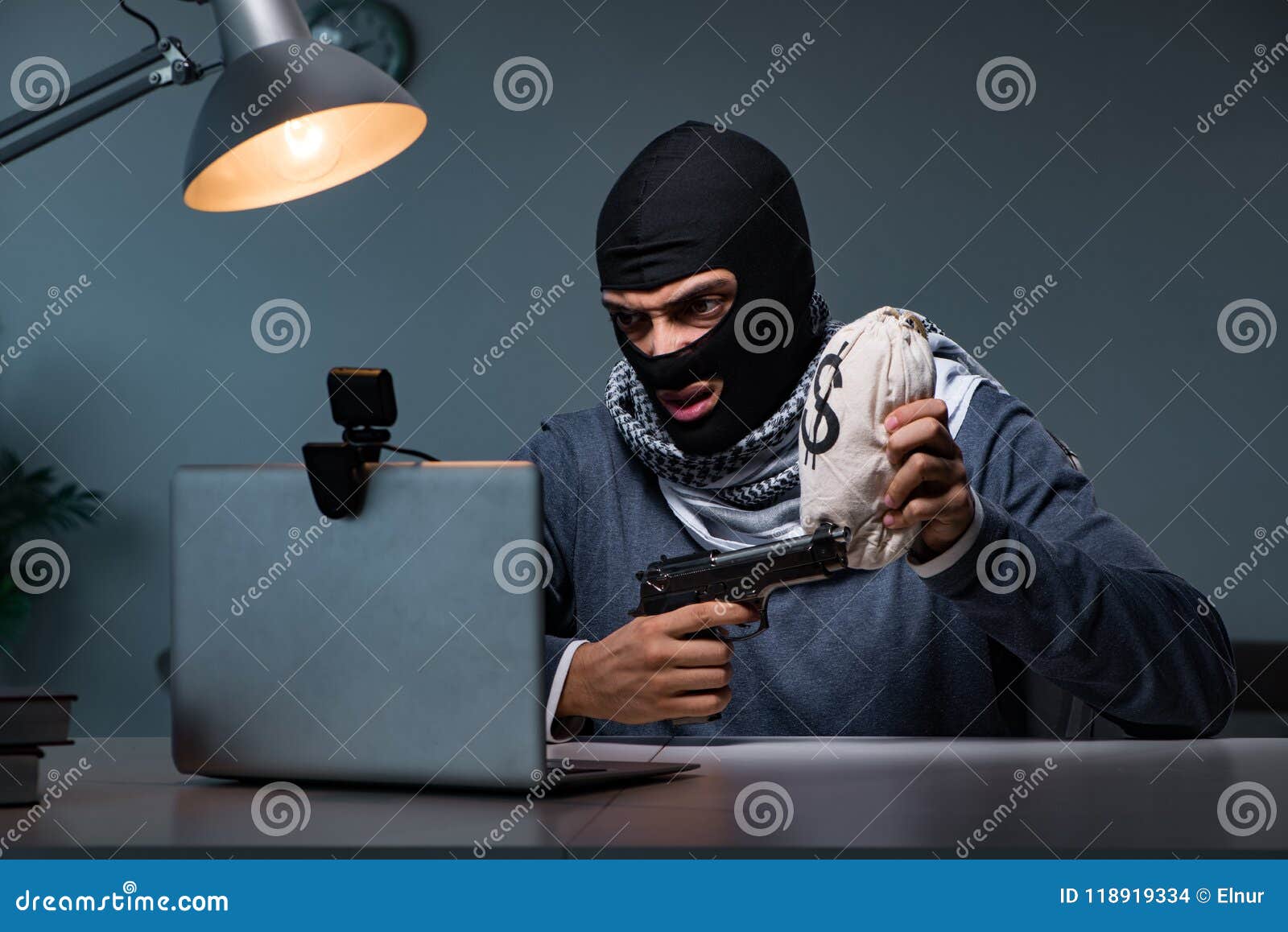 The Terrorist Burglar with Gun Working at Computer Stock Photo - Image ...