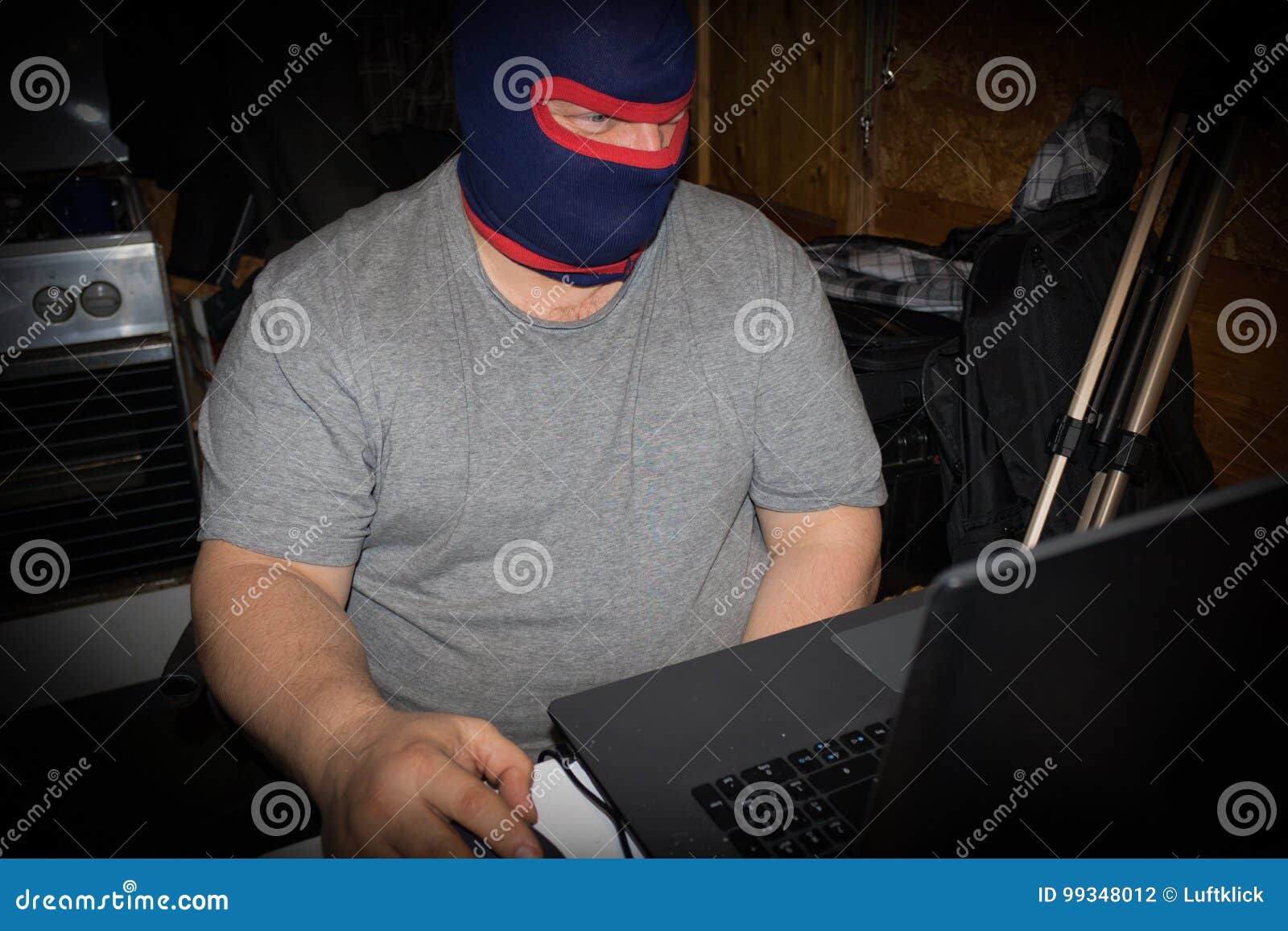 Masked Terrorist Working on His Computer. Concept about International ...