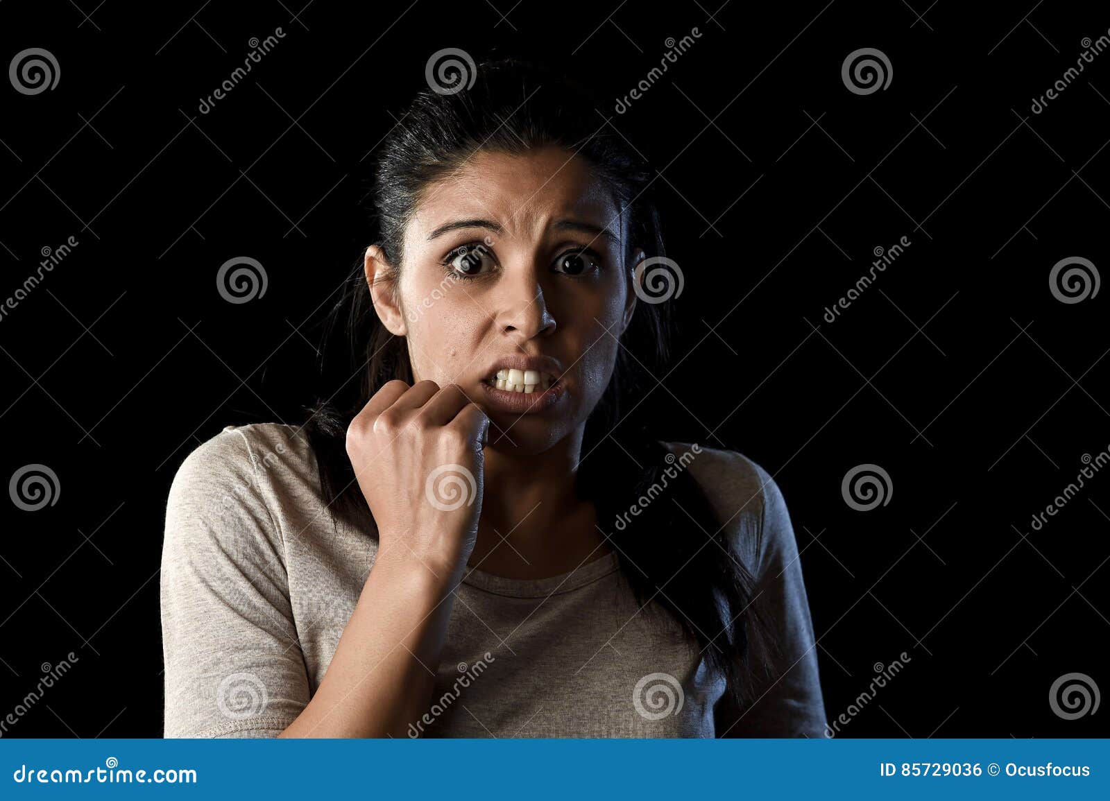 Terrorized And Horrified Woman Desperate And Scared Isolated On Black