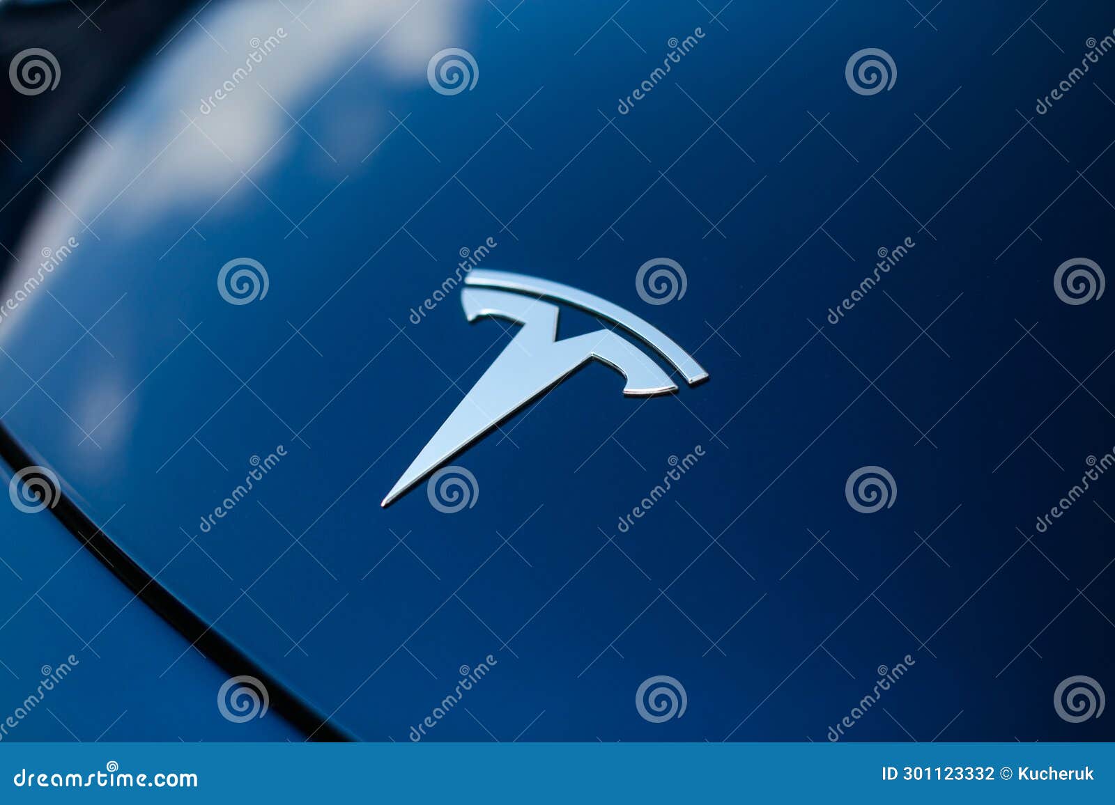 Tesla Logo On Screen And Elon Musk In A Background. He Is A CEO Of ...