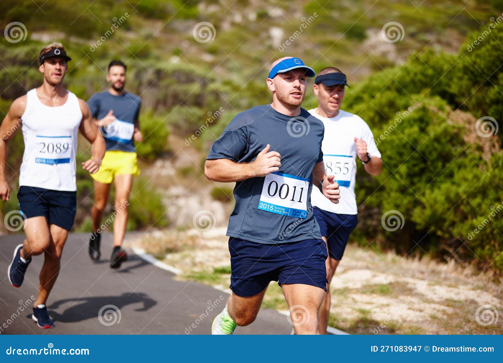 Test of Endurance. a Group of Young Men Running a Marathon. Stock Image ...