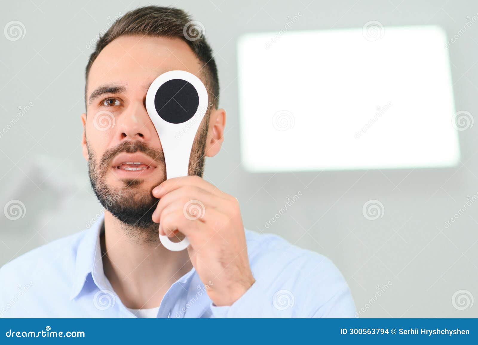 Test of Sight. Man is Checking His Vision Indoors in the Clinic Stock ...