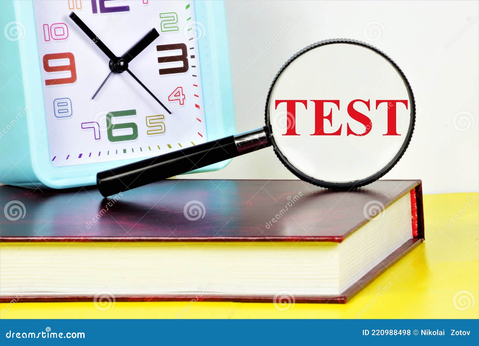 Test. Text Inscription on the Background of the Clock and the Textbook ...