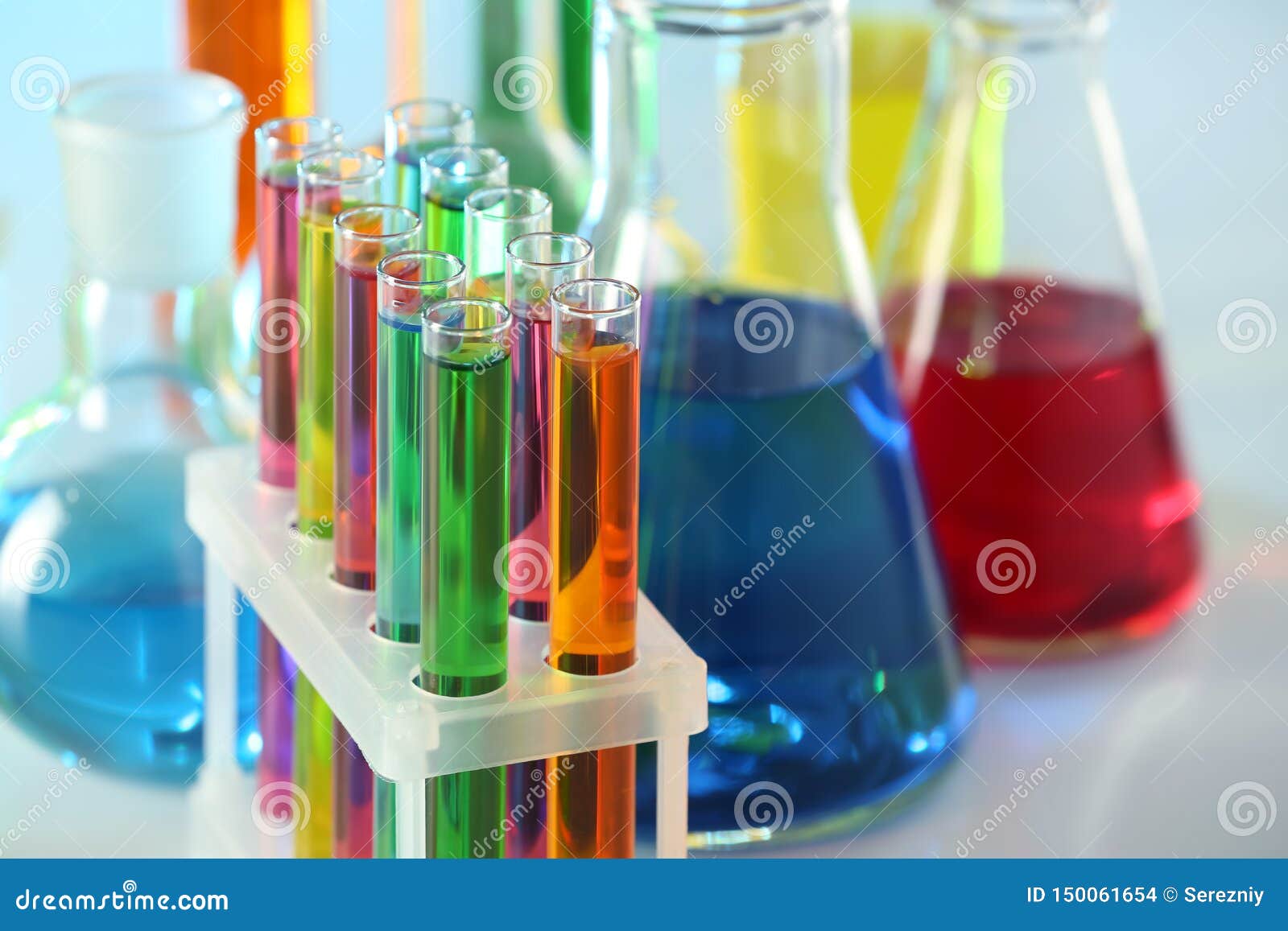 Test Tubes with Colorful Liquids in Rack, Closeup Stock Photo - Image ...