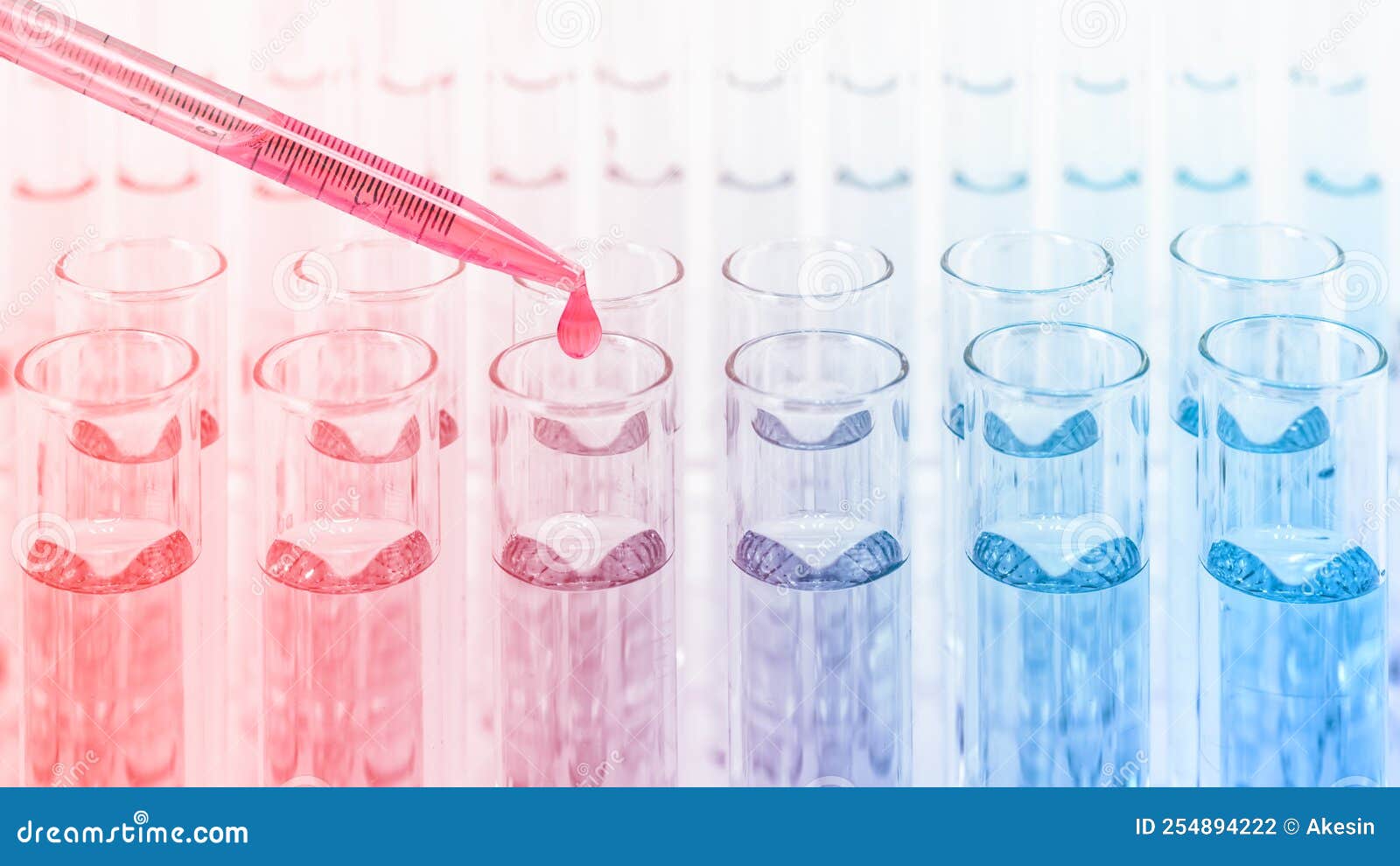 Test Tubes with Dropper Drop Some Blue Liquid in Laboratory Stock Photo ...