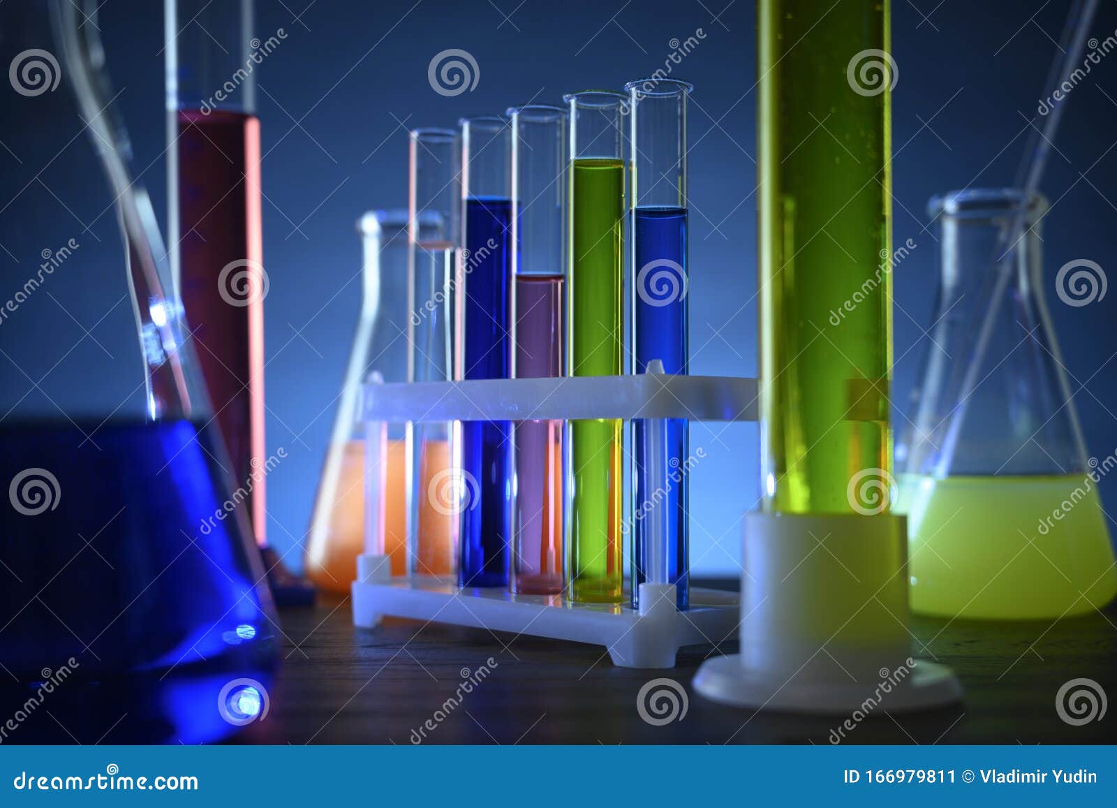 Test Tubes and Flasks with Colored Liquids Stand on a Table in a ...