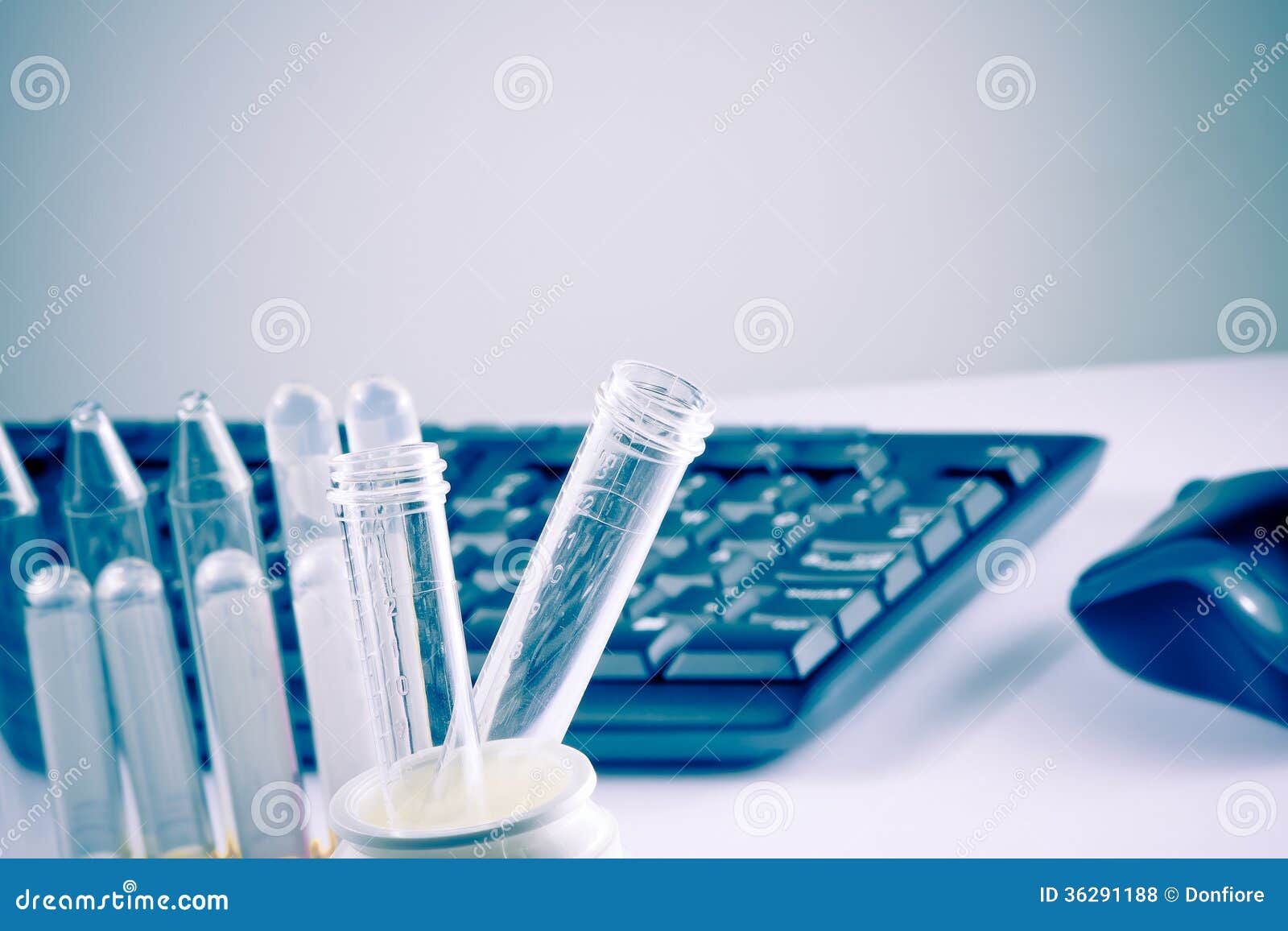 Test Tubes in Laboratory on Table Near Computer Keyboard and Mouse ...