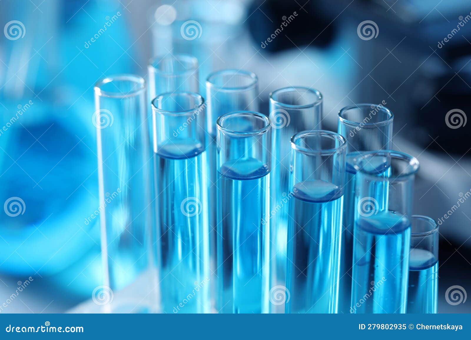 Test Tubes with Light Blue Liquid in Laboratory, Closeup Stock Image ...