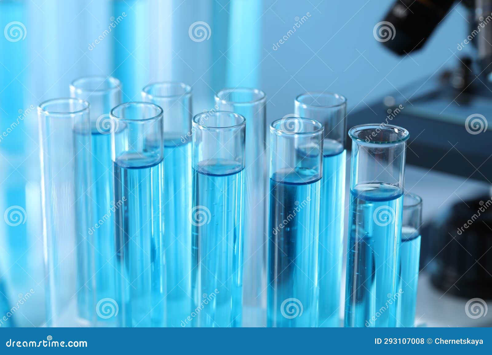 Test Tubes with Light Blue Liquid in Laboratory, Closeup Stock Photo ...