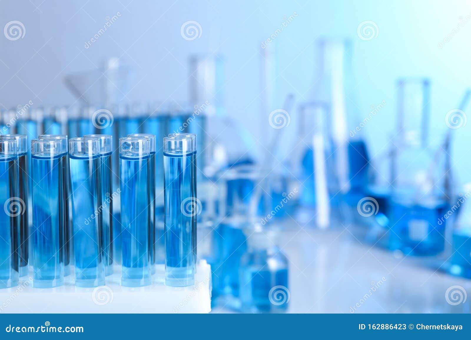 Test Tubes with Liquid Samples for Analysis in Laboratory. Space for ...