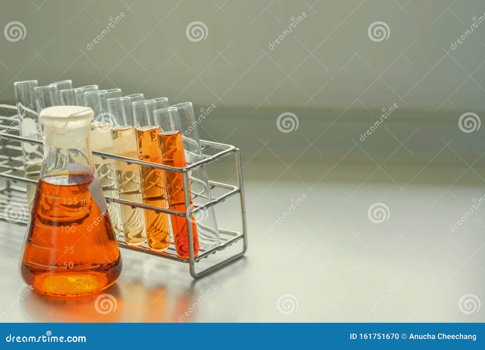 Test Tubes and Orange Liquid in Flask in Science Laboratory Stock Photo ...