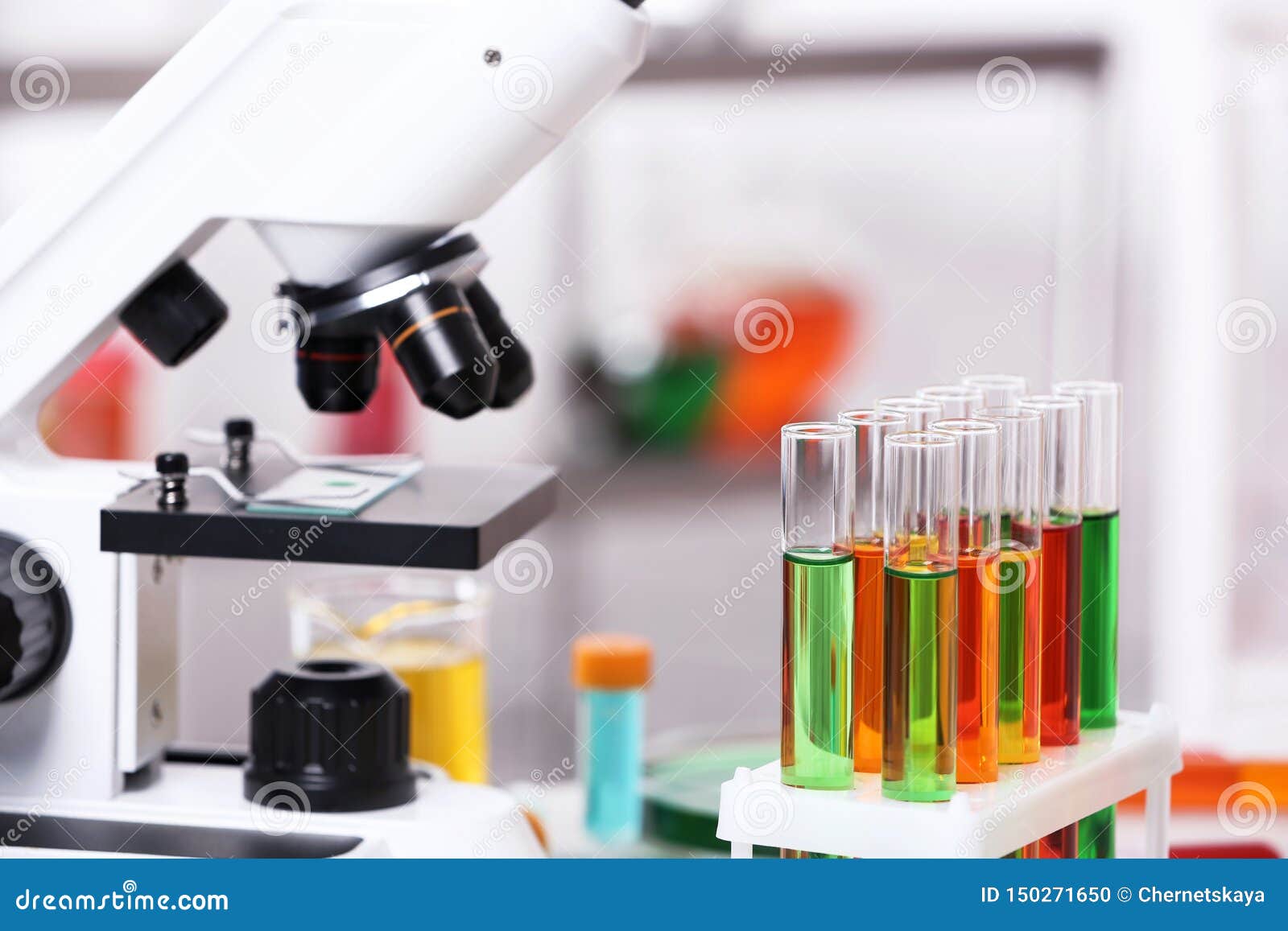 Test Tubes with Samples and Microscope in Laboratory Stock Photo ...