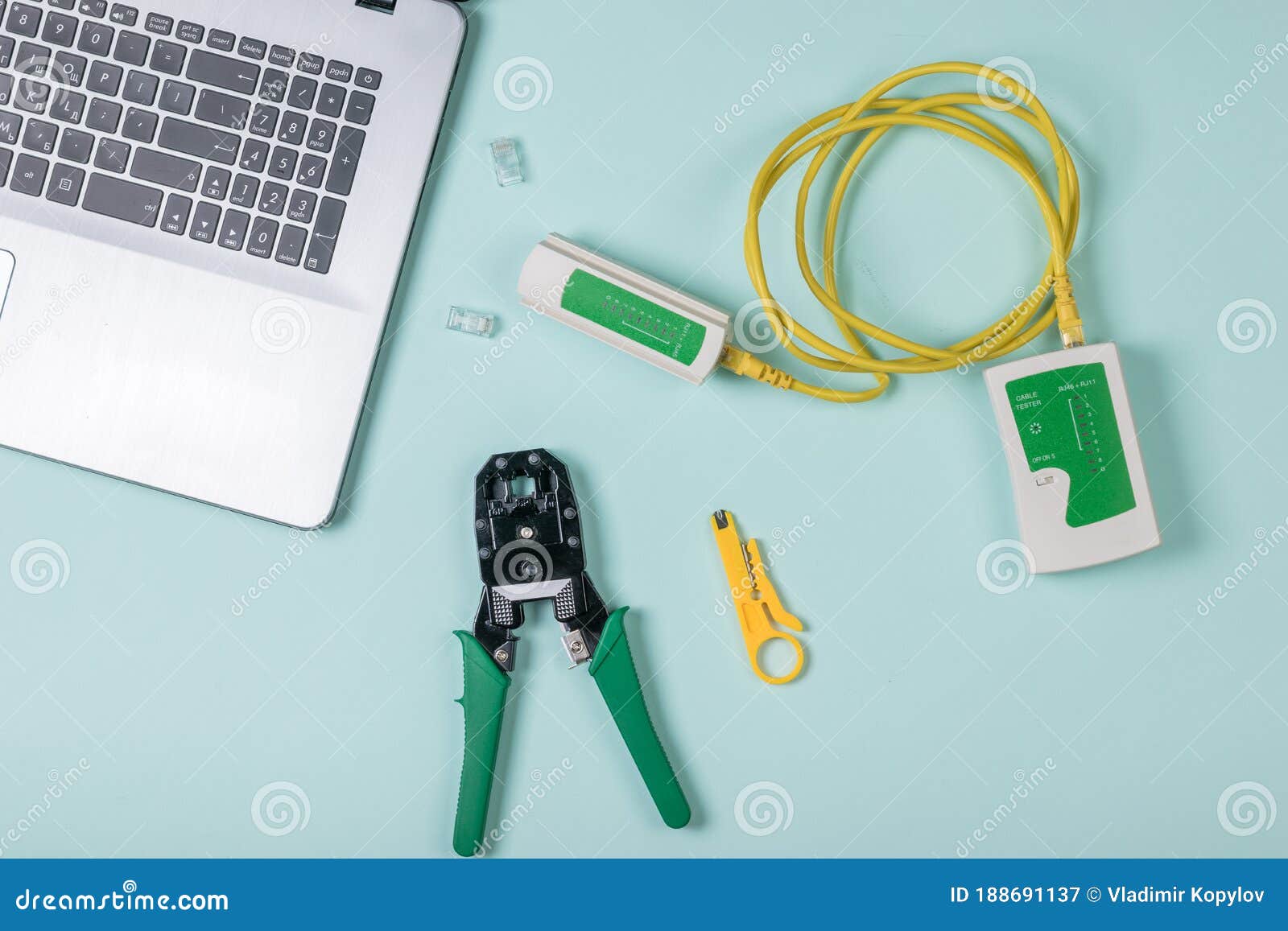 The Tester Checks the Cable for Connecting the Laptop To the Internet ...