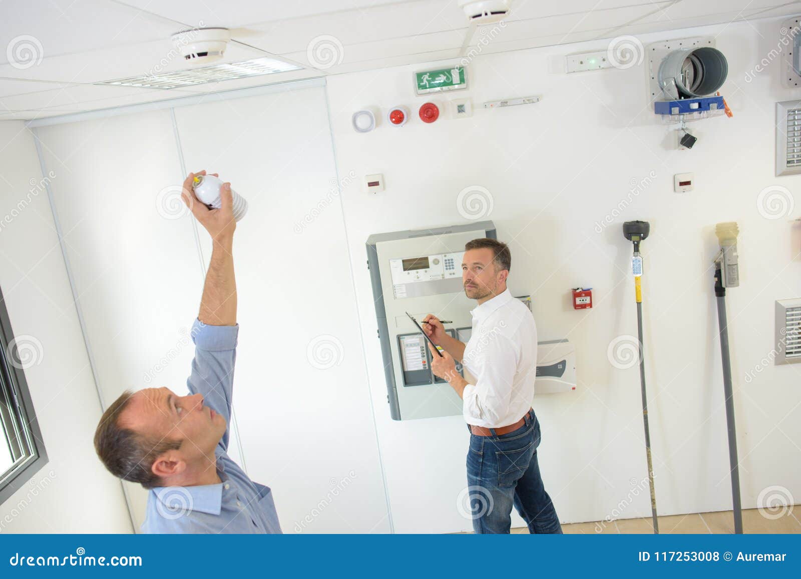 Testing the smoke detector stock photo. Image of domestic - 117253008