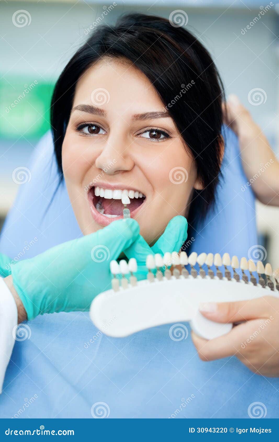 Testing Whiteness of Teeth of a Patient Stock Photo - Image of ...
