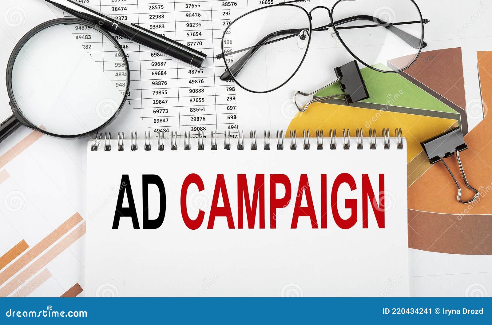 Text AD CAMPAIGN on White Paper Notebook on the Diagram. Business ...