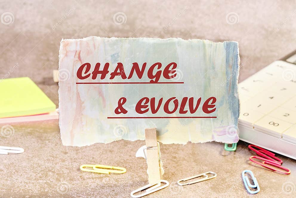 The Text CHANGE EVOLVE Written on a Piece of Paper in a Clothespin ...