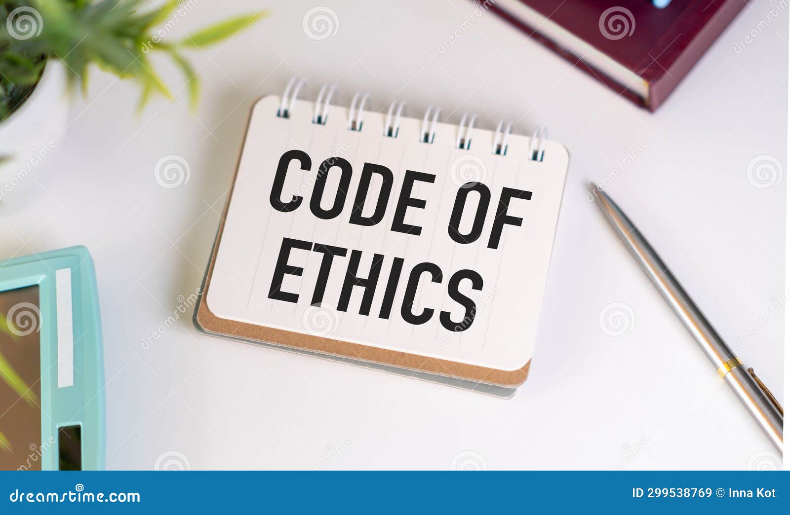 Text Code of Ethics on a White Sticker with Office Stationery ...