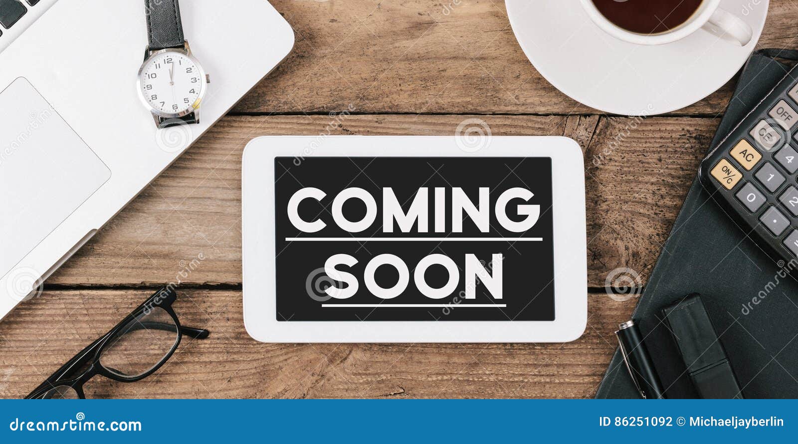 Text Coming Soon on Screen of Table Computer at Office Desk Stock Photo ...